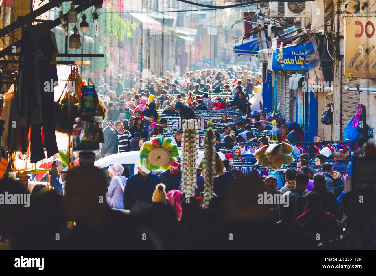 Jordan, Middle East, Amman. Al Balad district. Crowd of men in the ...