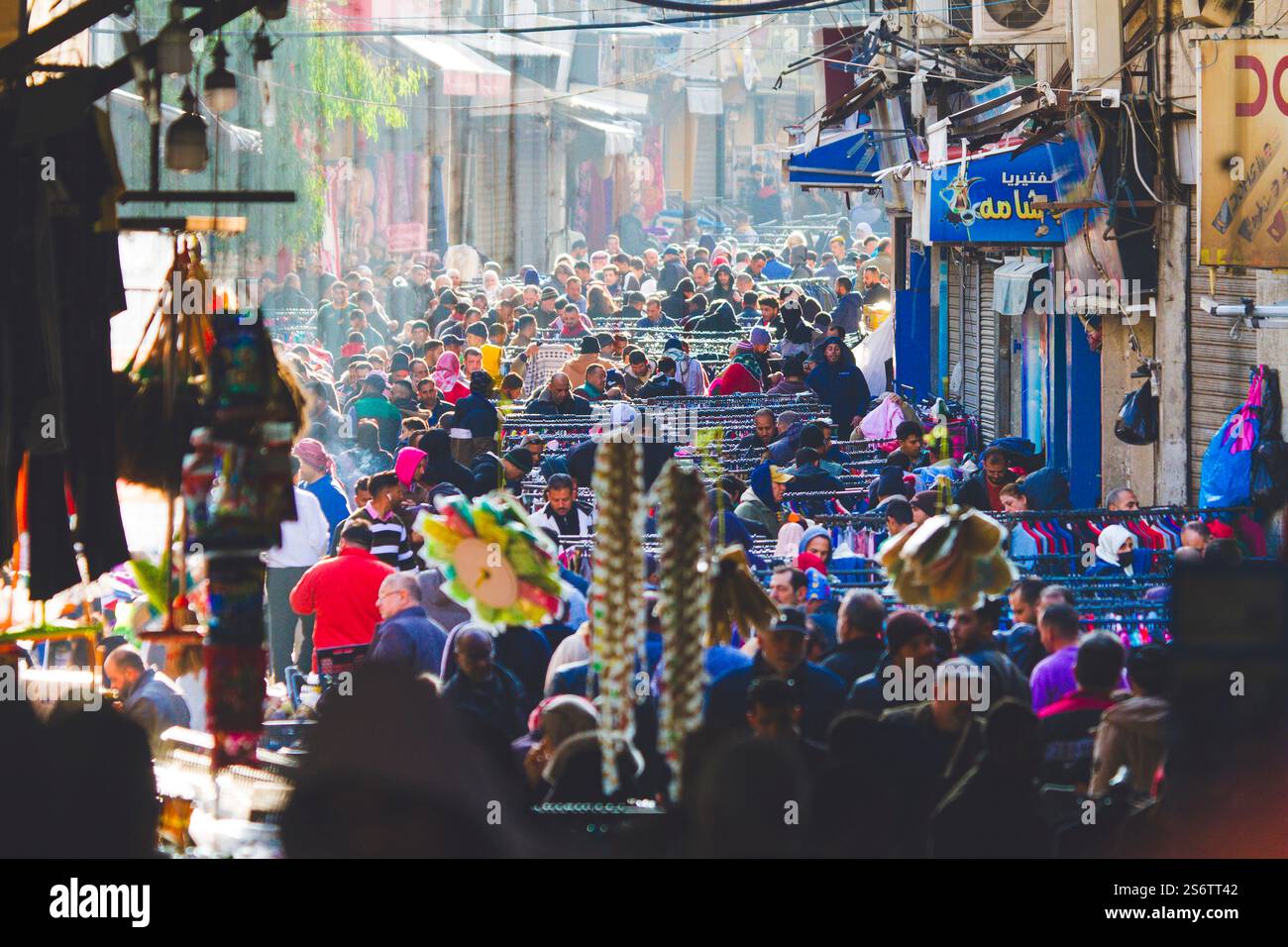 Jordan, Middle East, Amman. Al Balad district. Crowd of men in the ...