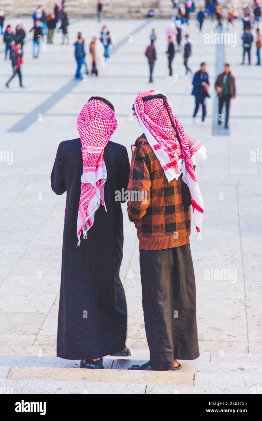 Jordan, Middle East, Amman, ancient roman theater, two young Jordanians ...