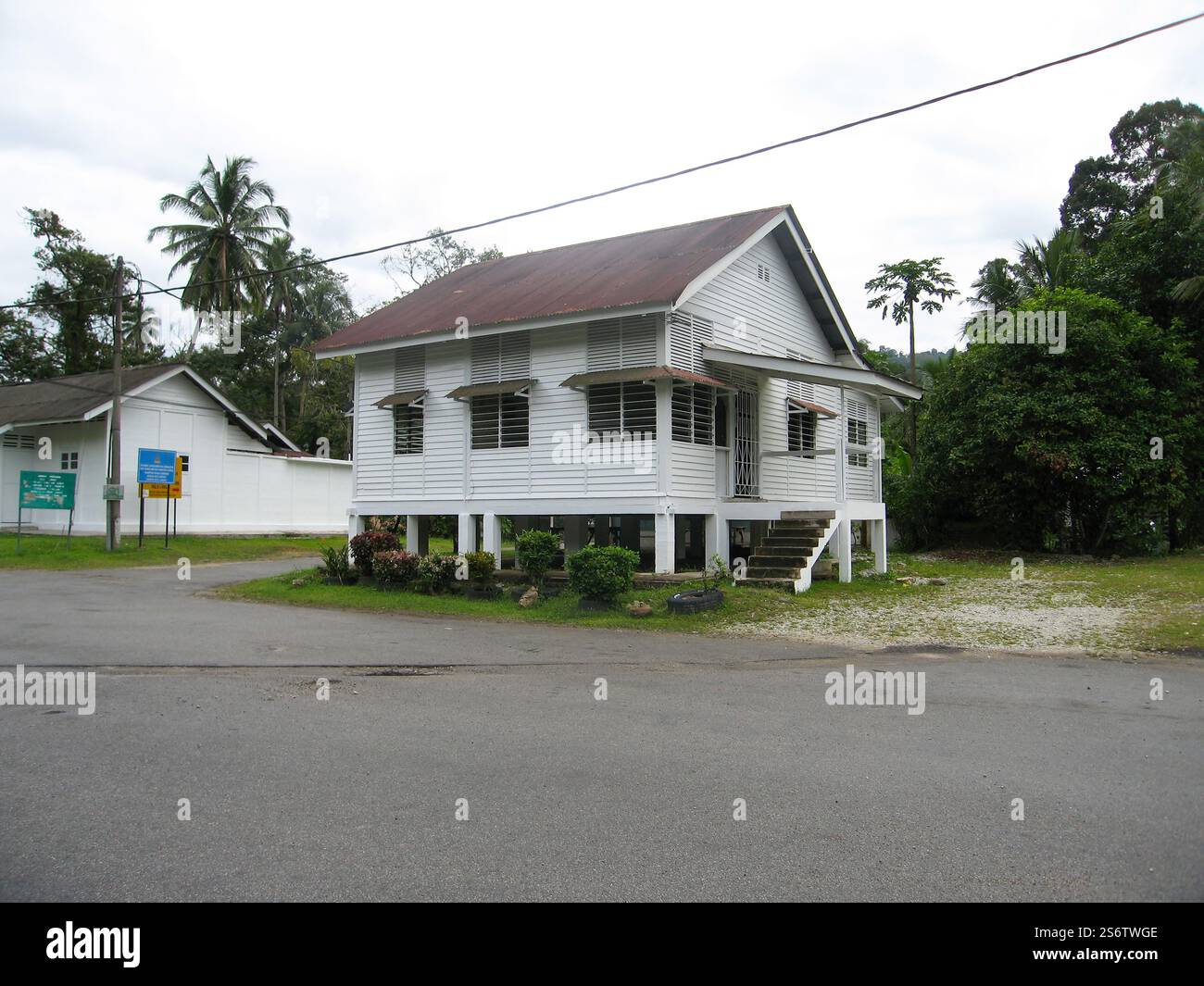 A typical traditional Malay wooden house on stilts in the village of ...