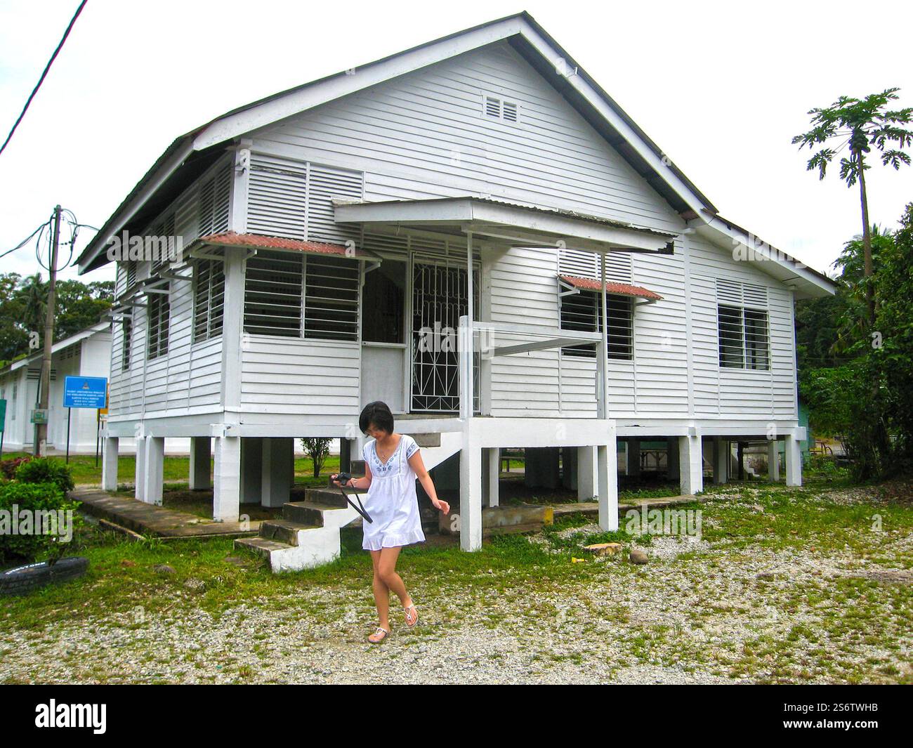 A typical traditional Malay wooden house on stilts in the village of ...