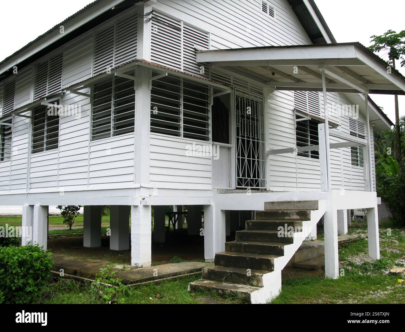 A typical traditional Malay wooden house on stilts in the village of ...