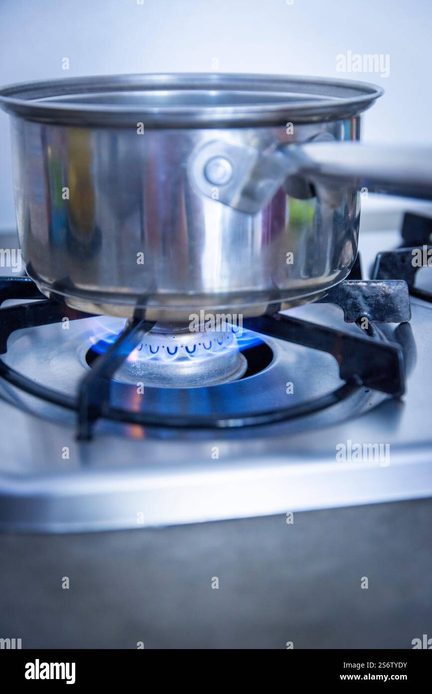 Close-up of the lit gas burners of a stove Stock Photo - Alamy