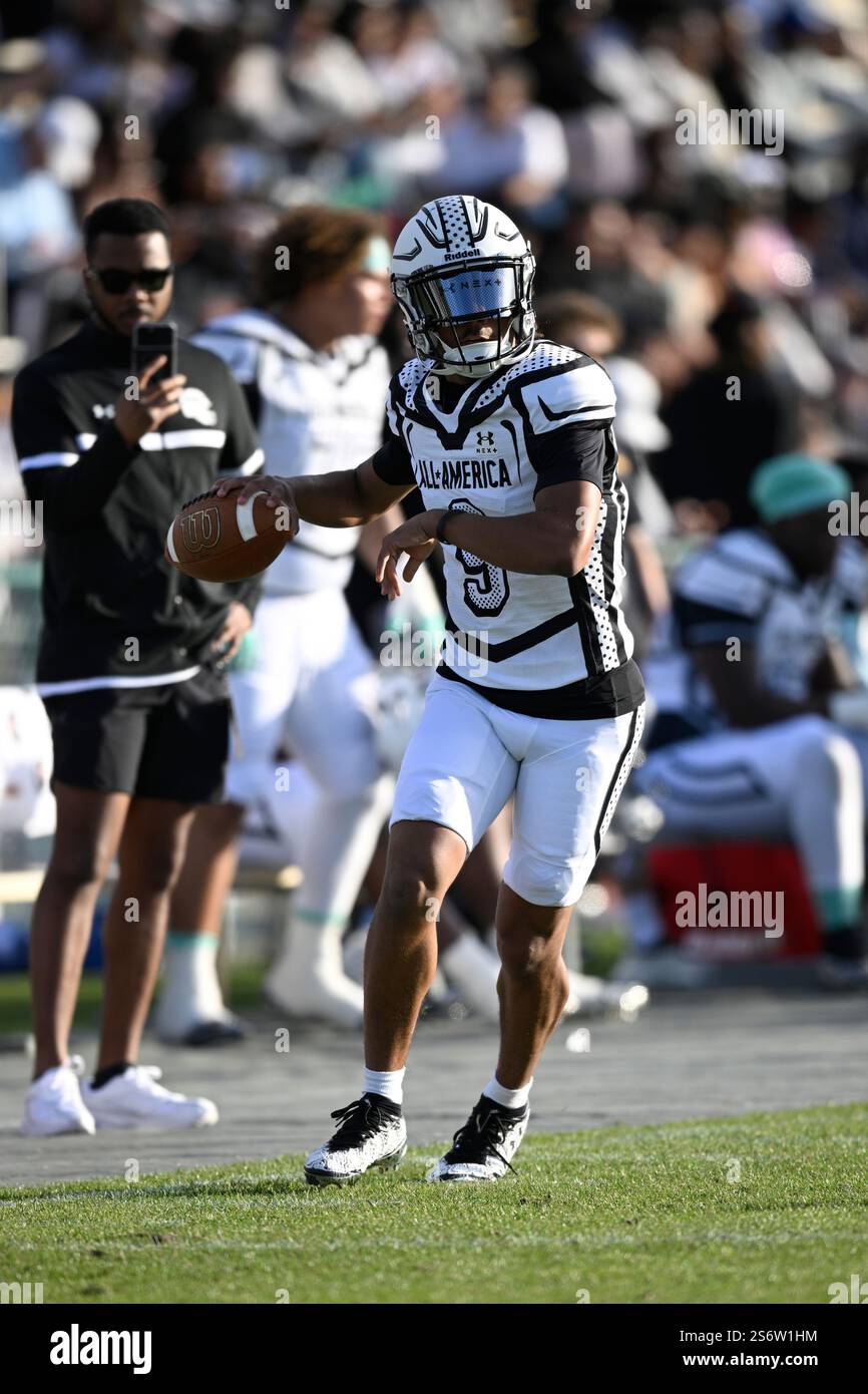 Team Unstoppable quarterback KJ Lacey (9) warms up before the Under ...