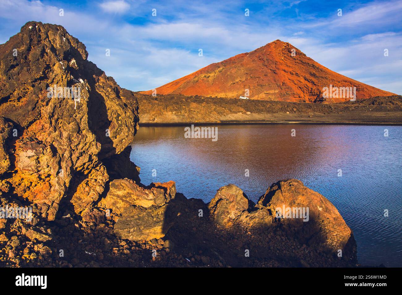 Spain, Canary Islands, Lanzarote. Small lake and beach in front of the ...