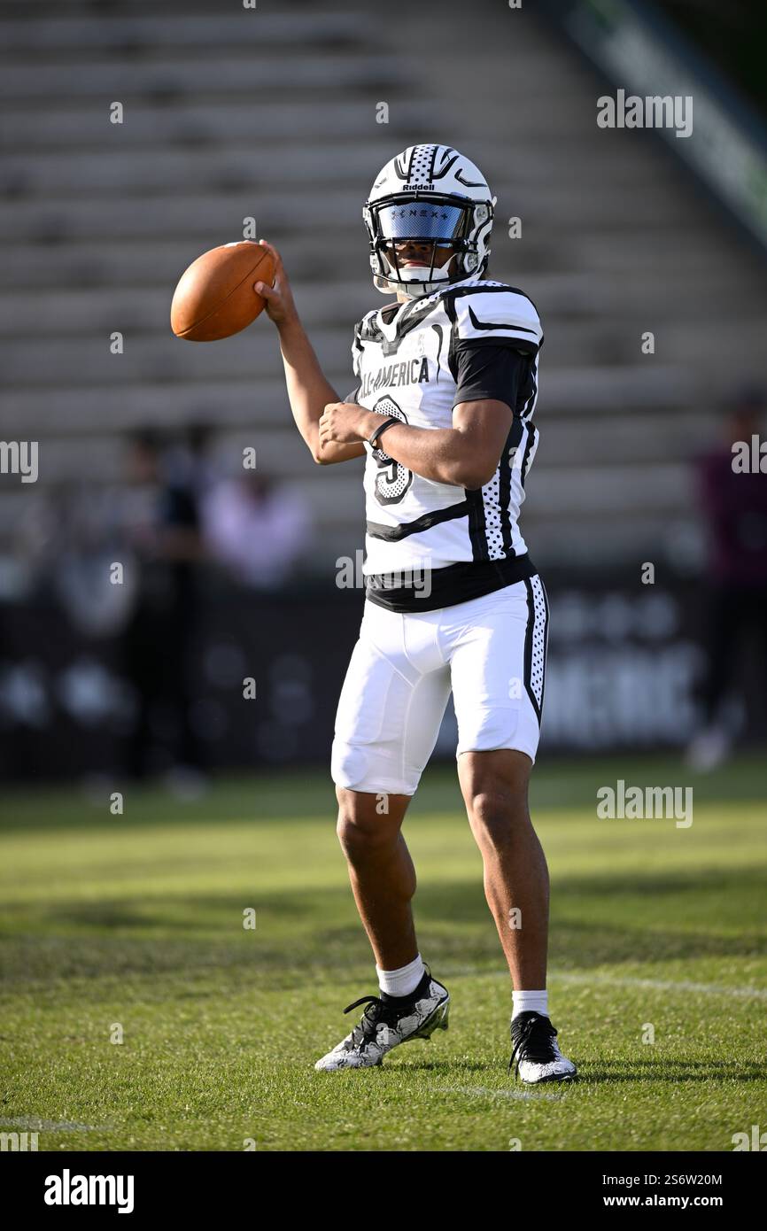 Team Unstoppable quarterback KJ Lacey (9) warms up before the Under ...