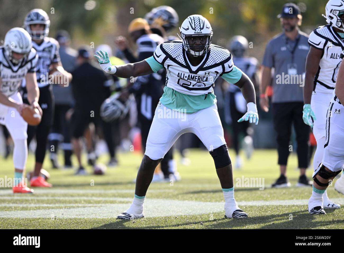 Team Unstoppable offensive lineman Michael Fasusi (56) warms up before ...