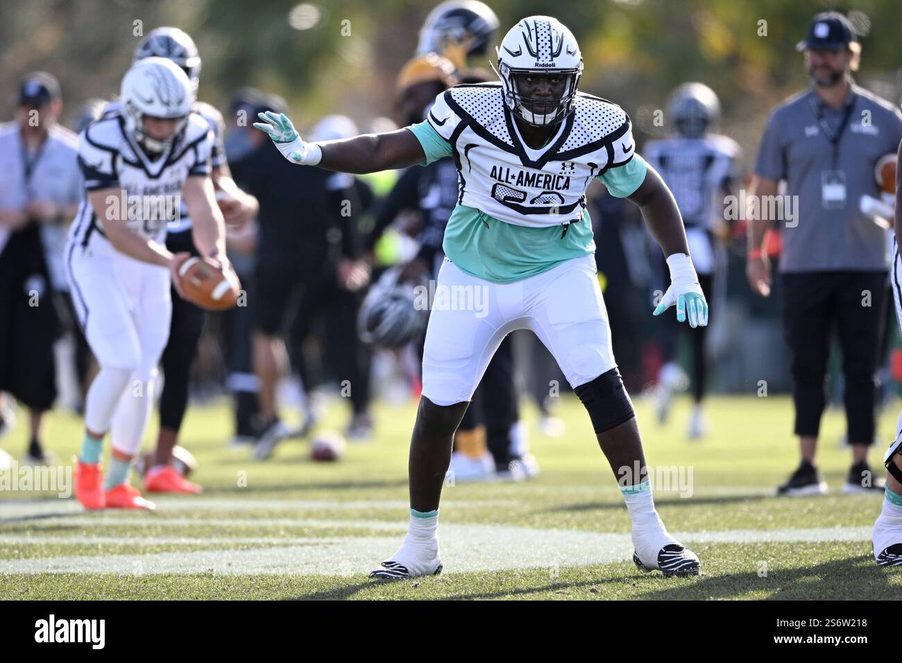 Team Unstoppable offensive lineman Michael Fasusi (56) warms up before ...