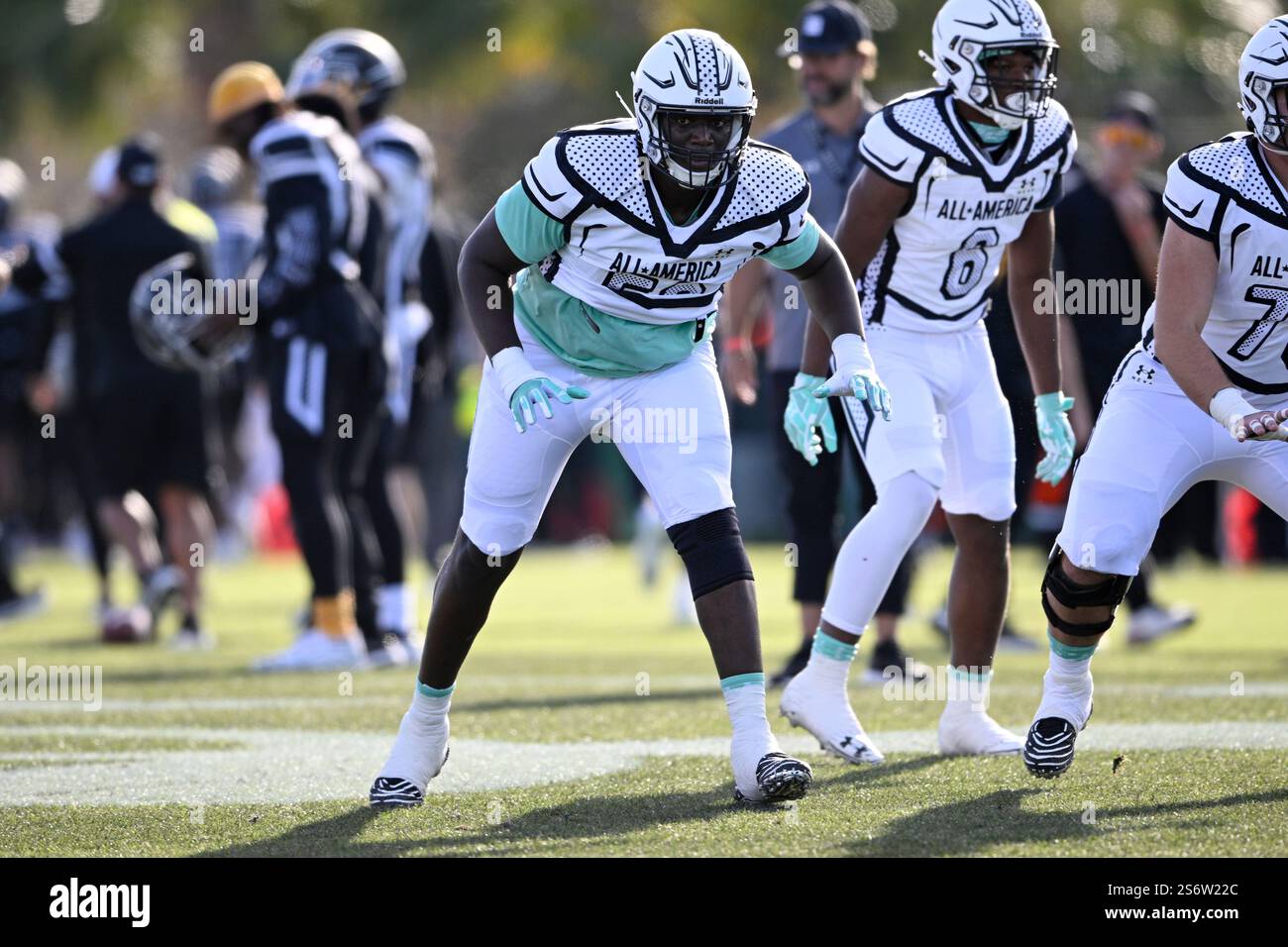 Team Unstoppable offensive lineman Michael Fasusi (56) warms up before ...