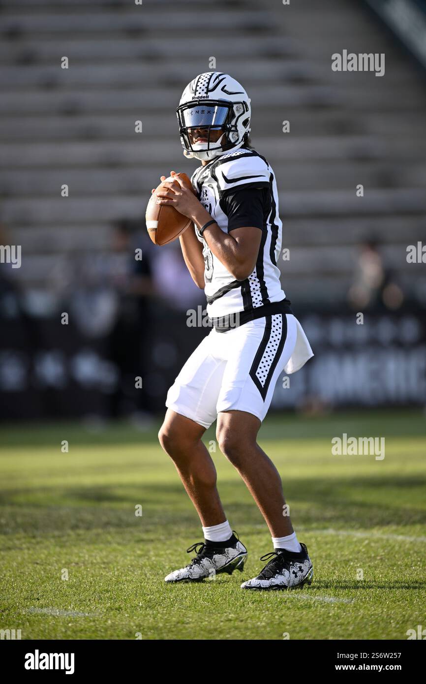 Team Unstoppable quarterback KJ Lacey (9) warms up before the Under ...