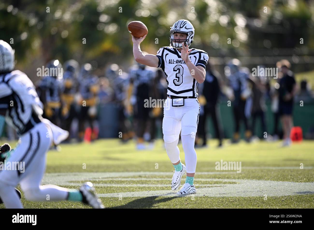 Team Unstoppable quarterback Derek Zammit (3) warms up before the Under ...
