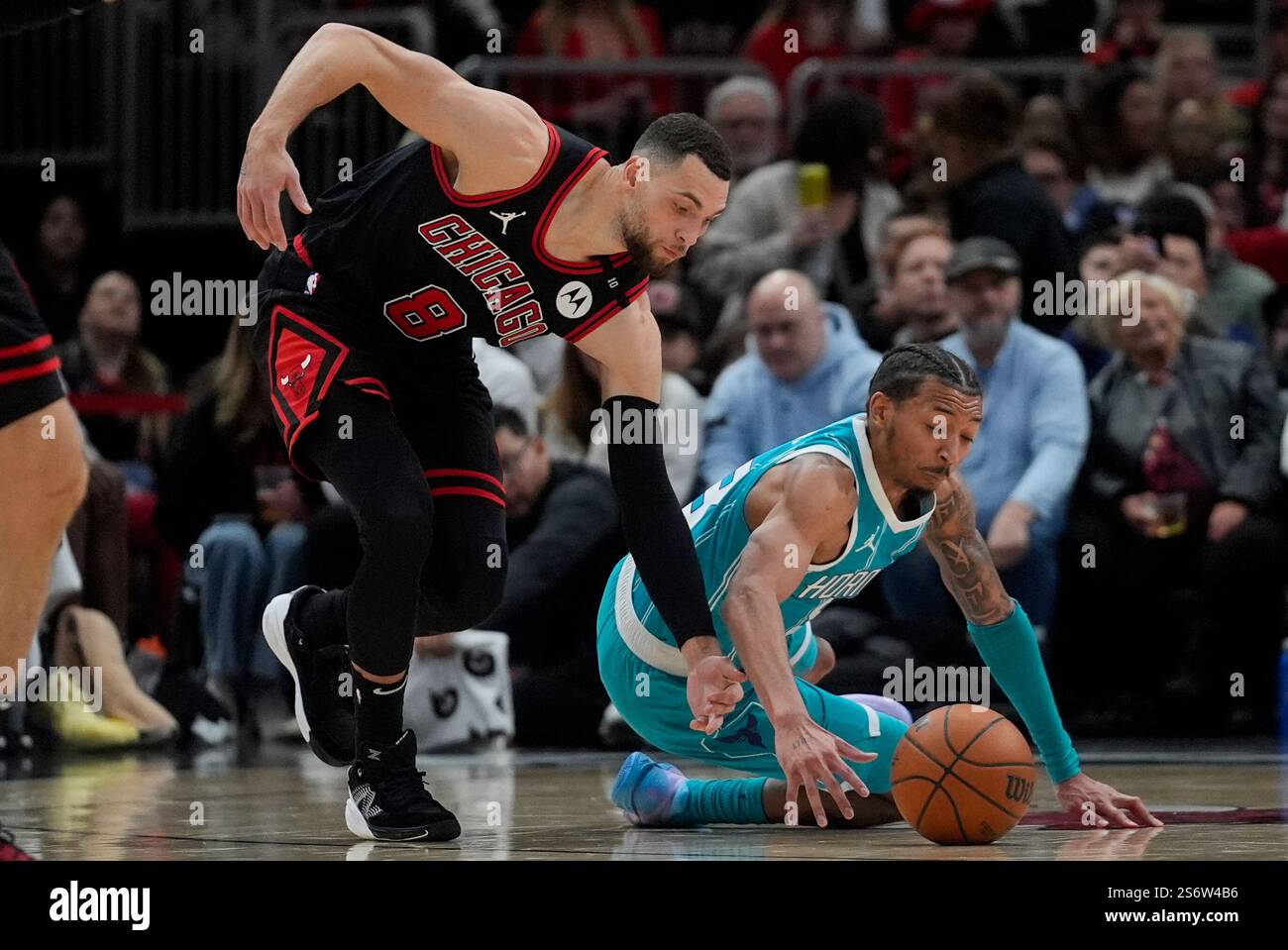Chicago Bulls guard Zach LaVine (8), left, grabs a loose ball from ...