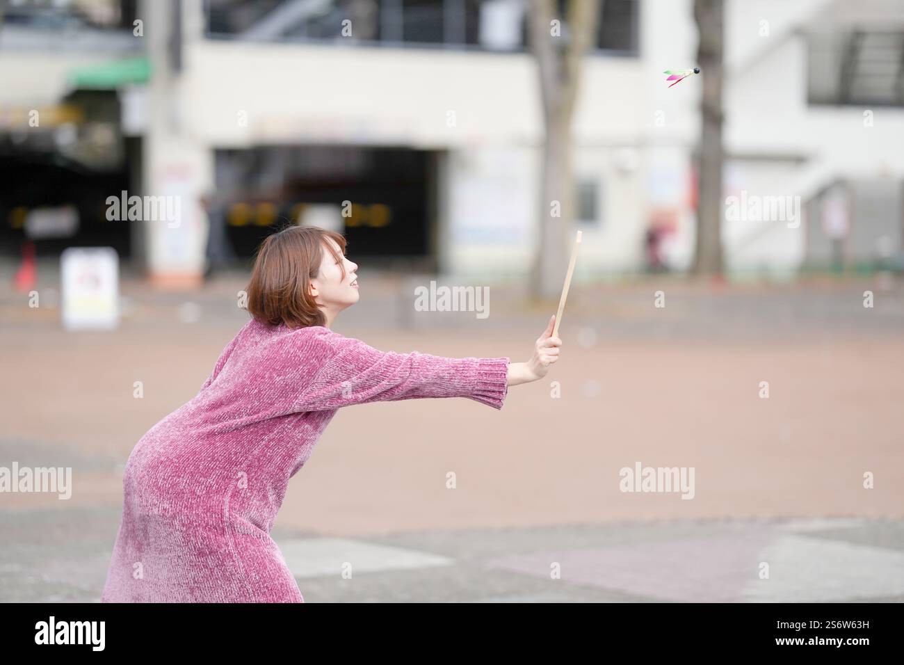 A Japanese man and woman in their 20s are playing hagoita, a ...