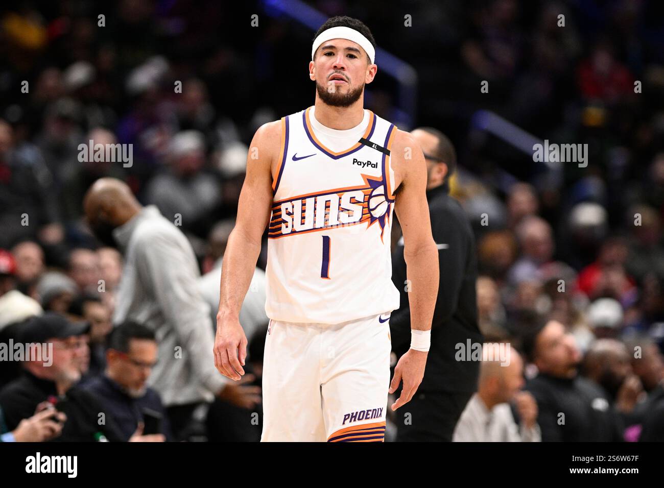 Phoenix Suns guard Devin Booker (1) looks on during the first half of ...