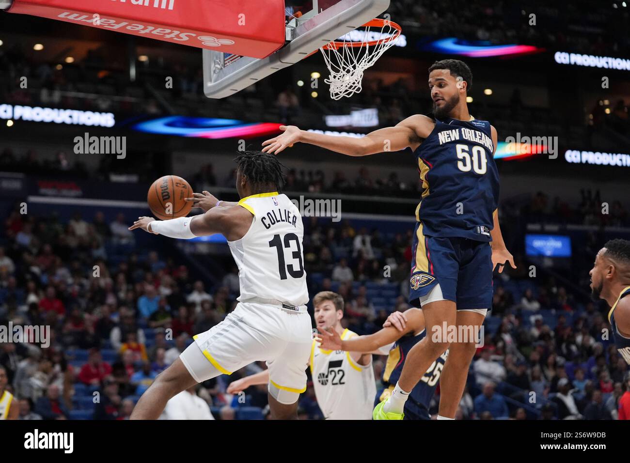 Utah Jazz guard Isaiah Collier (13) passes around New Orleans Pelicans ...