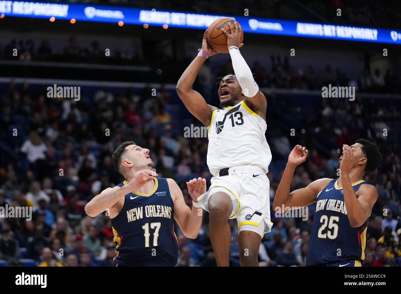 Utah Jazz guard Isaiah Collier (13) goes to the basket between New ...
