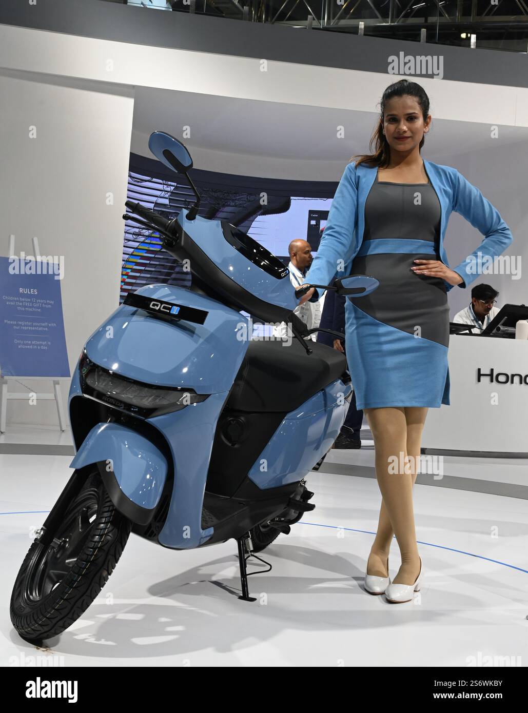 NEW DELHI, INDIA - JANUARY 17: Model with Honda QC E Bike and Activa E Bike during the Bharat ...