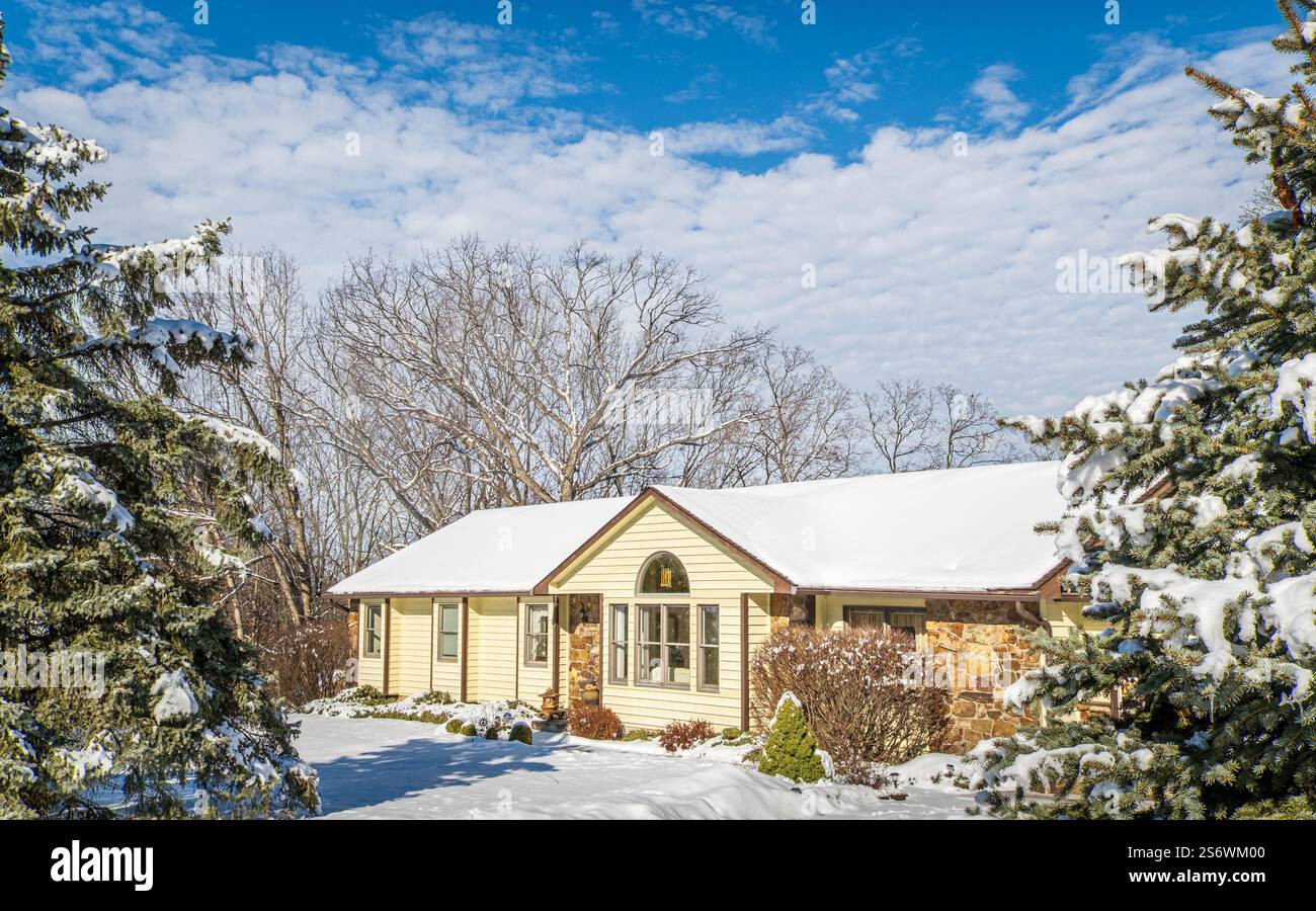 Beautiful view of Midwestern suburban house on sunny winter after snow ...