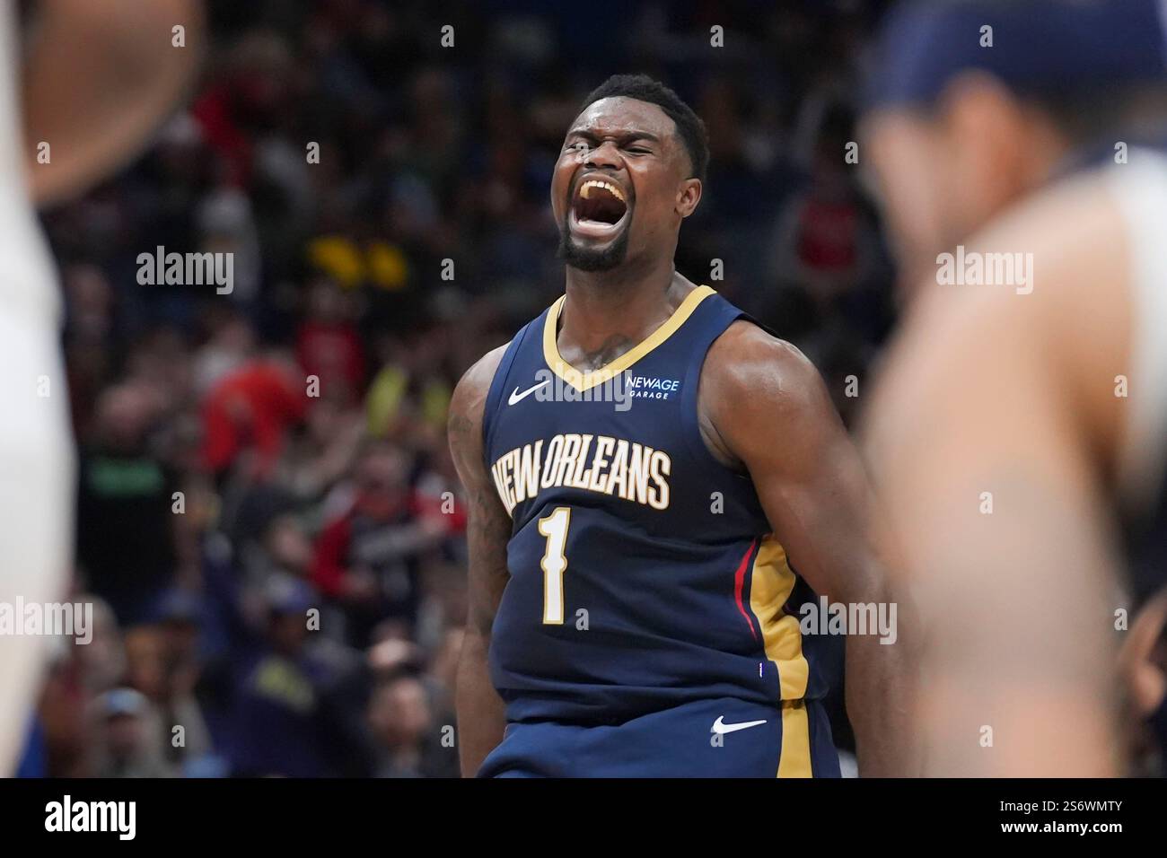 New Orleans Pelicans forward Zion Williamson (1) reacts after his alley ...
