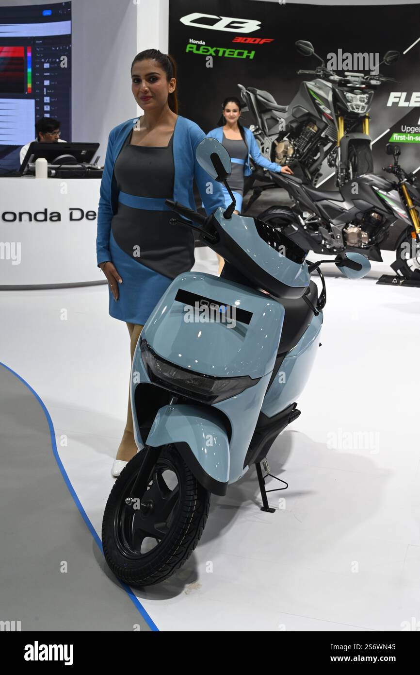New Delhi, India. 17th Jan, 2025. NEW DELHI, INDIA - JANUARY 17: Model with Honda QC E Bike and ...