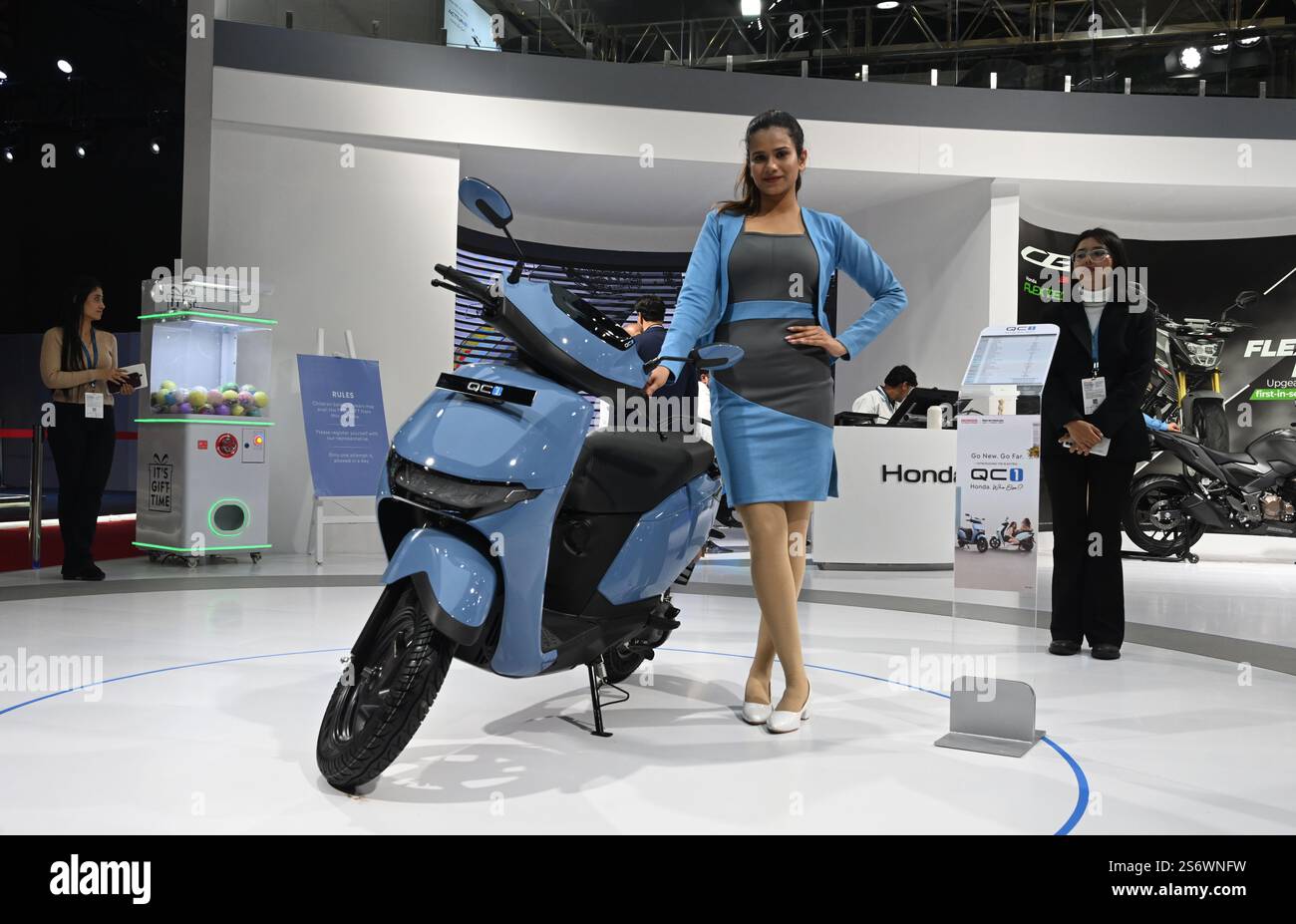 New Delhi, India. 17th Jan, 2025. NEW DELHI, INDIA - JANUARY 17: Model with Honda QC E Bike and ...