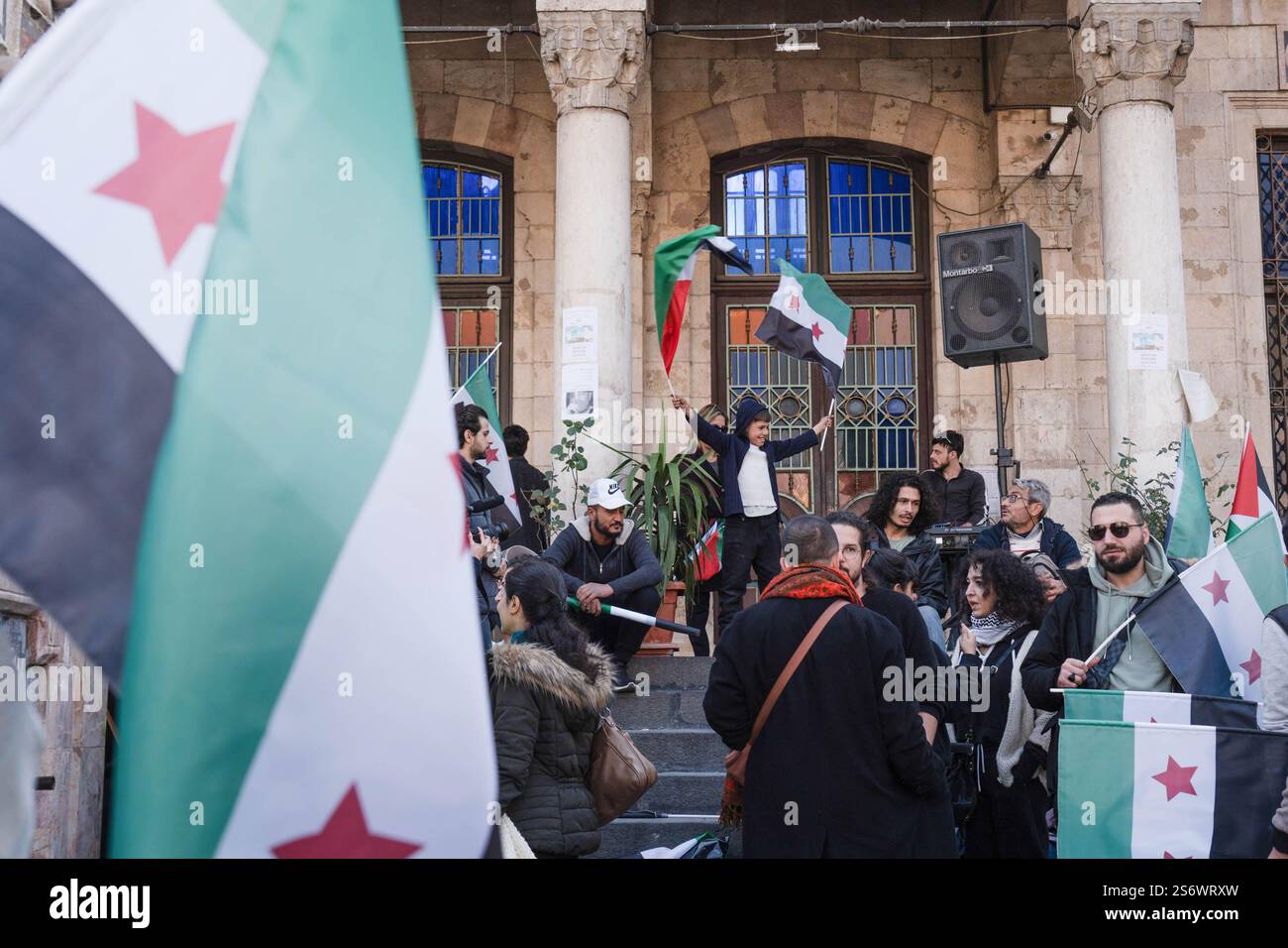 Damascus, Syria. 17th Jan, 2025. Dozens of people are seen waving the ...