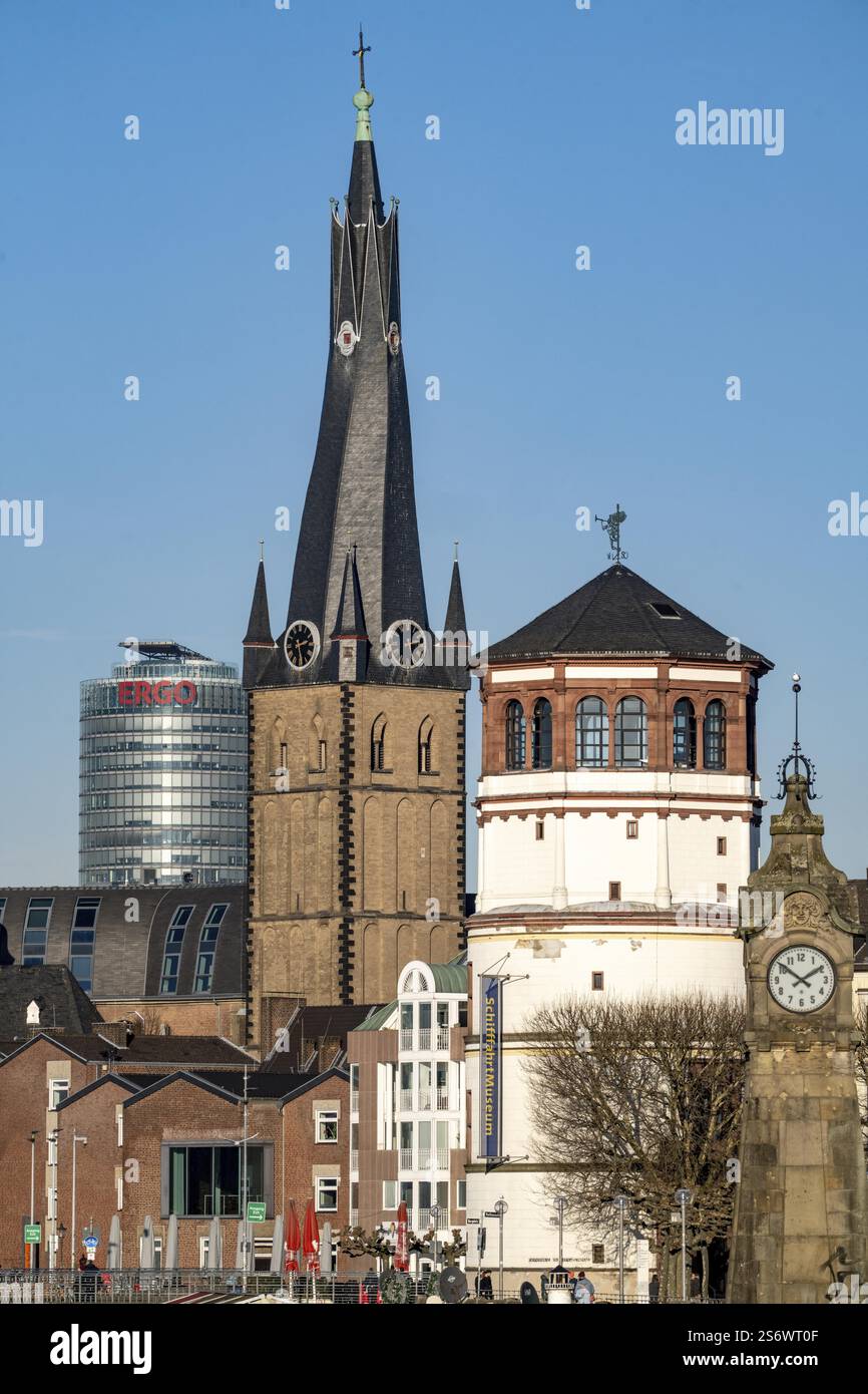 Rhine promenade in Duesseldorf, old castle tower, St Lambert's Basilica ...