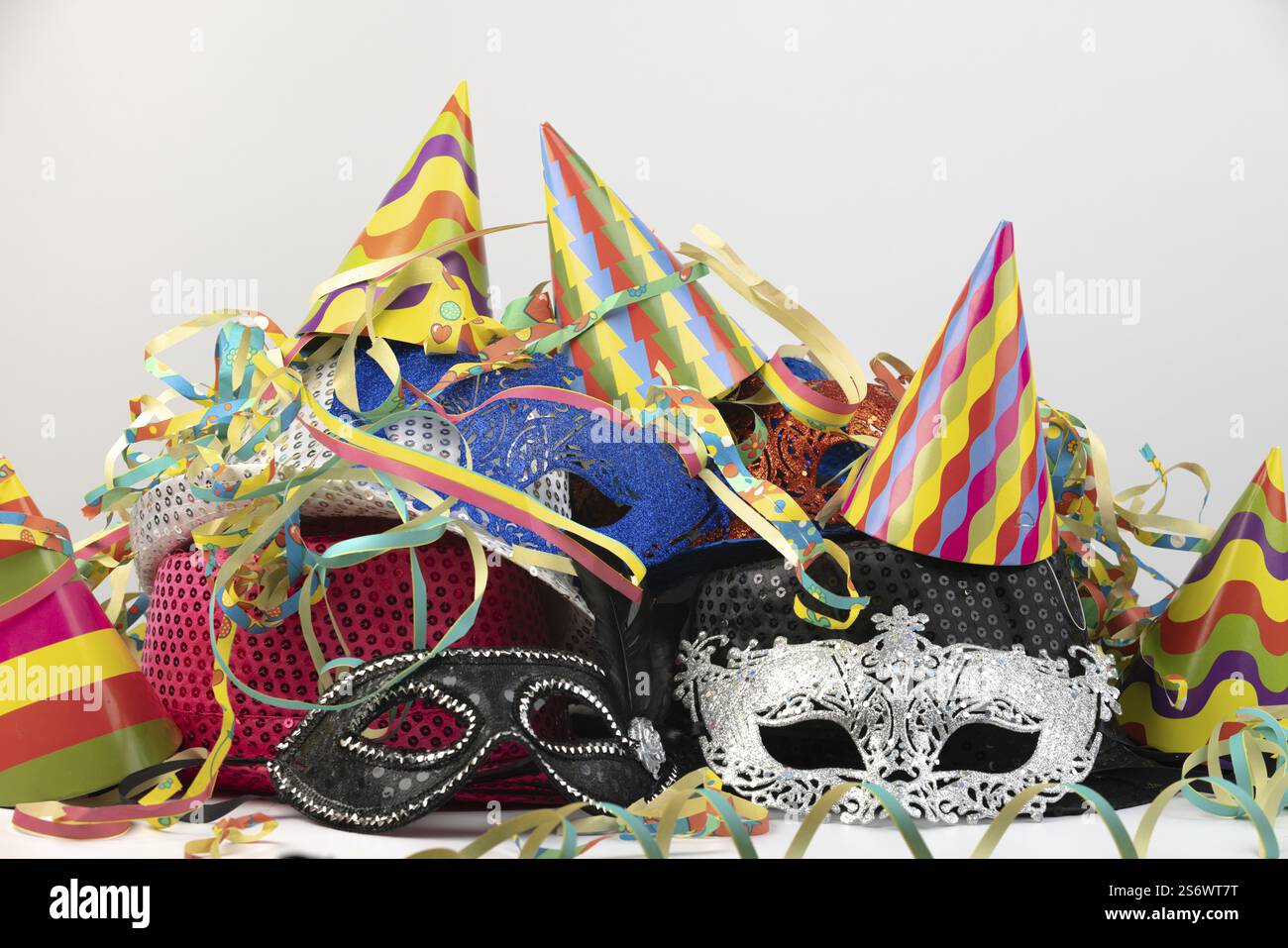 Colourful party hats and carnival masks, decorated with colourful ...