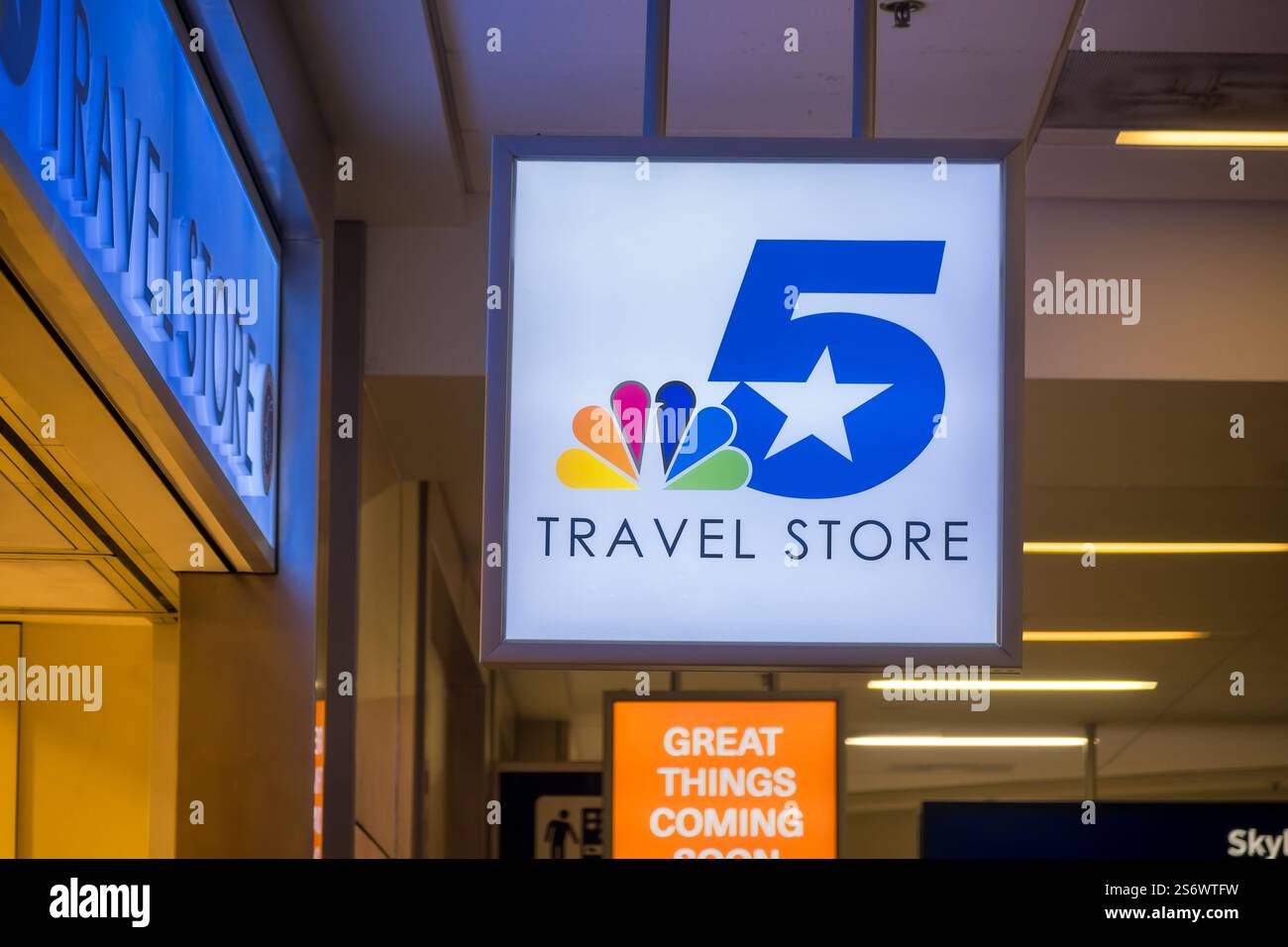 Dallas, Texas - December 24, 2024: NBC 5 travel store sign board at Dallas Fort Worth ...