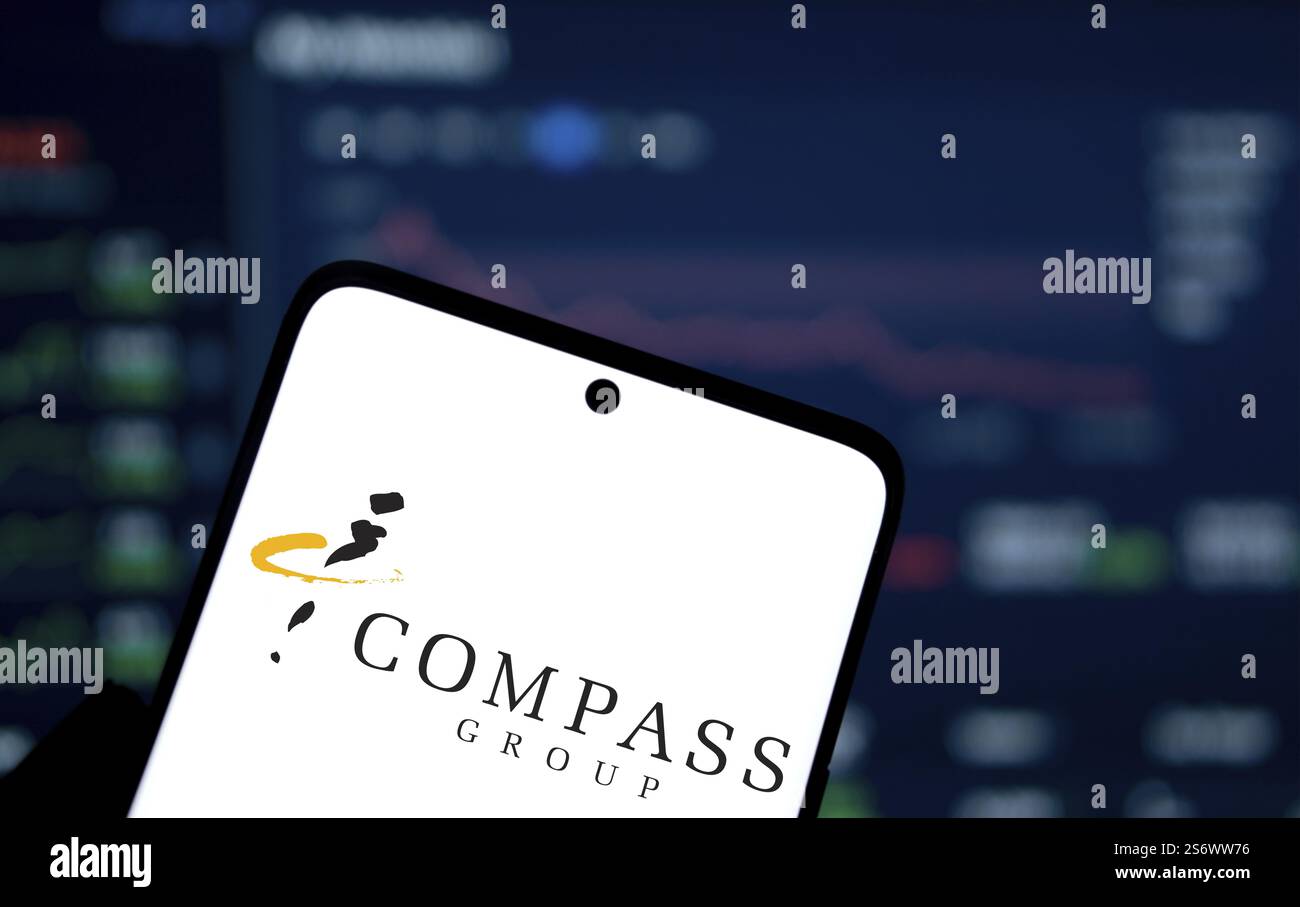 Compass Group logo is displayed on smartphone Stock Photo - Alamy