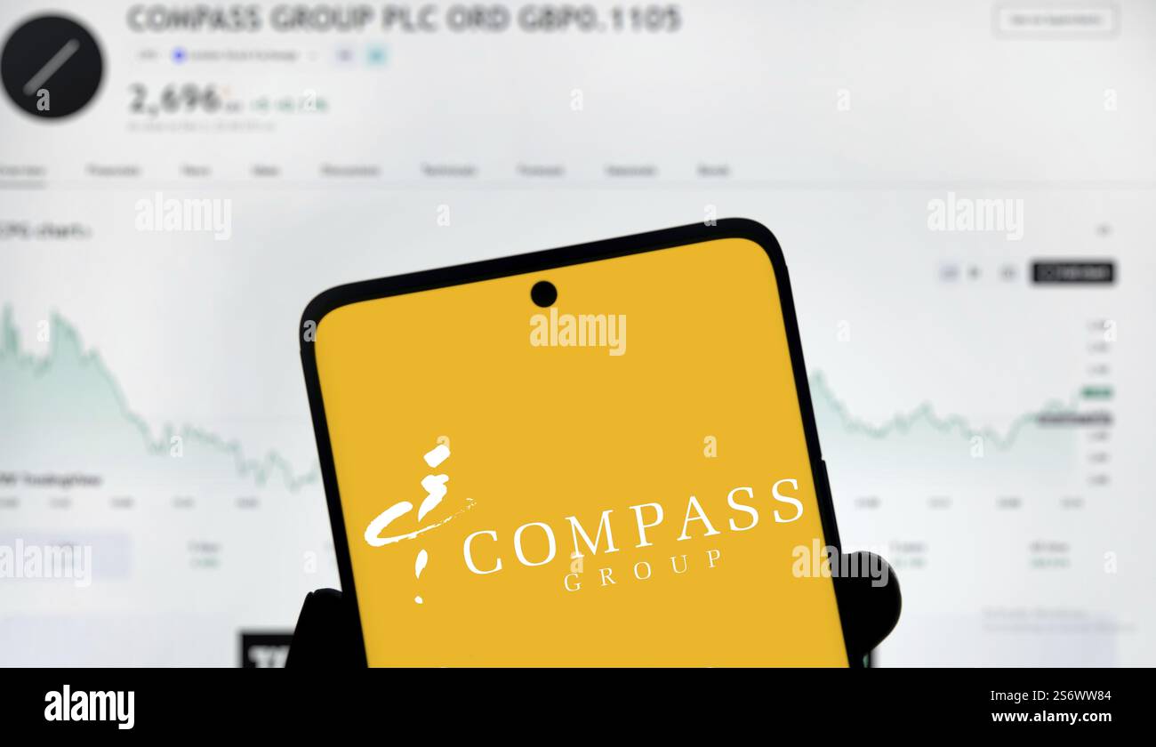Compass Group logo is displayed on smartphone Stock Photo - Alamy