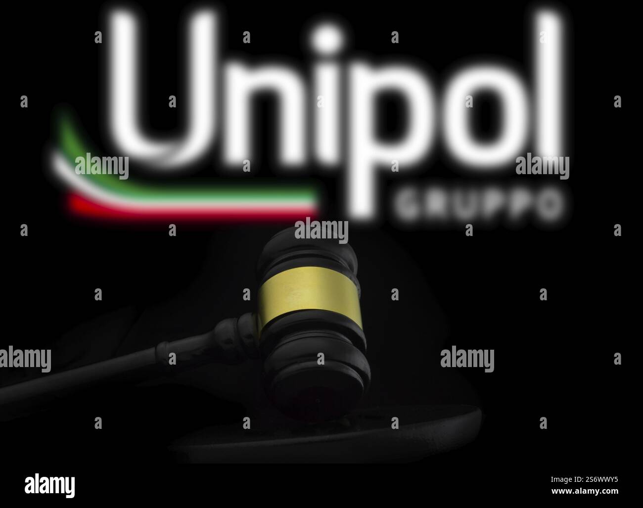 Court gavel in front of the Unipol gruppo logo. Unipol Gruppo S.p.A. is ...