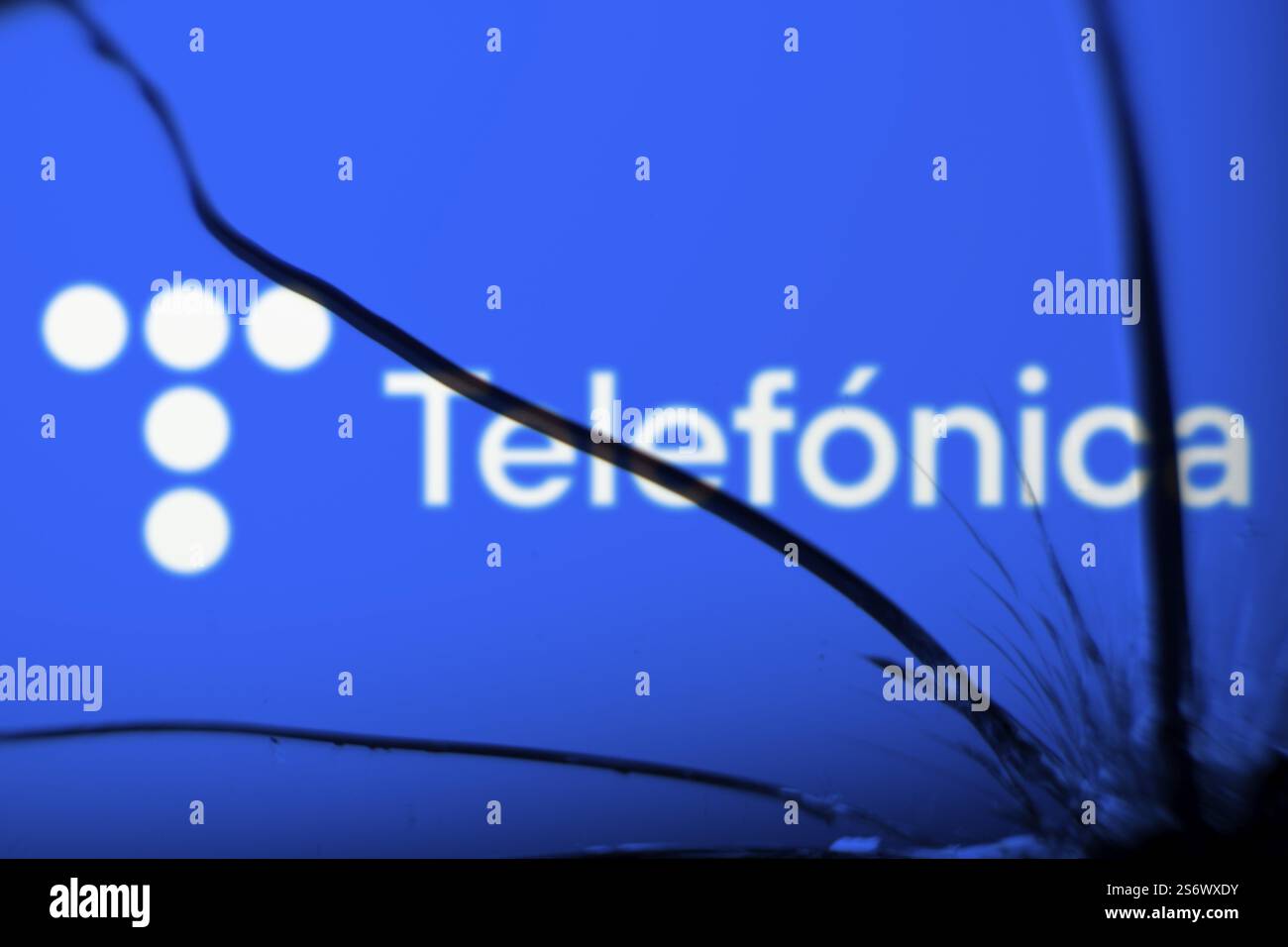 Telefonica logo is visible on the broken glass Stock Photo - Alamy