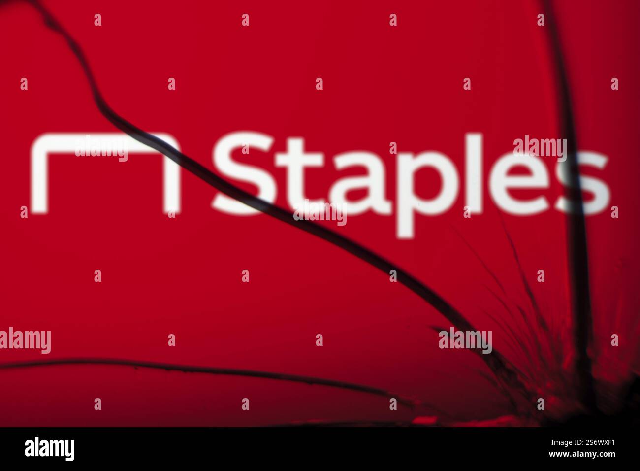 Staples logo is visible on the broken glass Stock Photo - Alamy