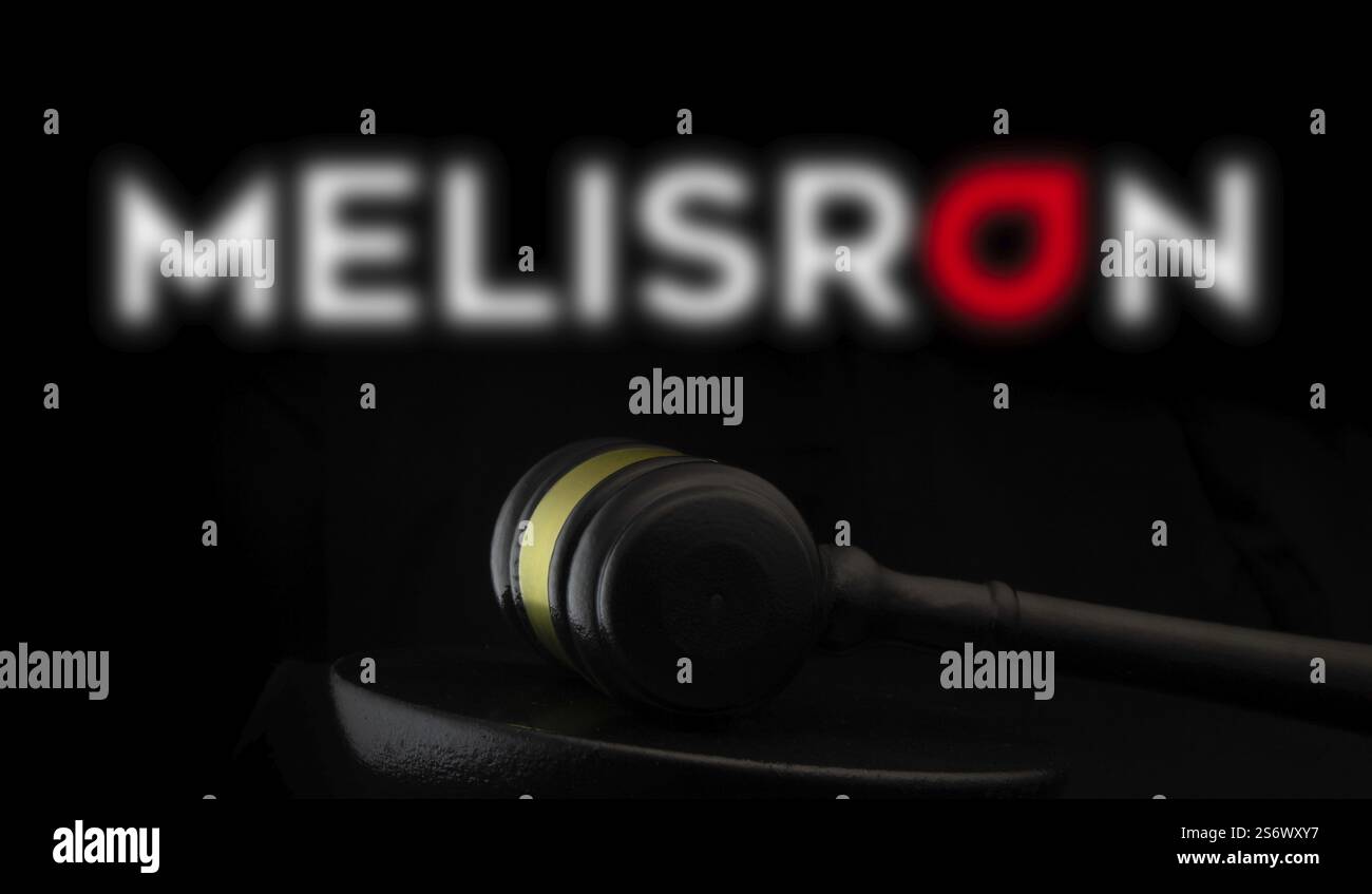 Court gavel in front of the Melisron logo. Melisron Ltd is an Israel based investment company ...
