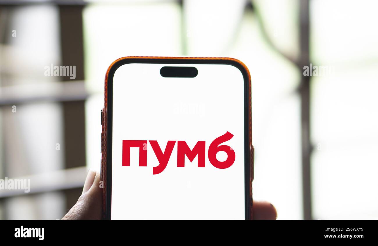 First Ukrainian International Bank logo is displayed on smartphone ...
