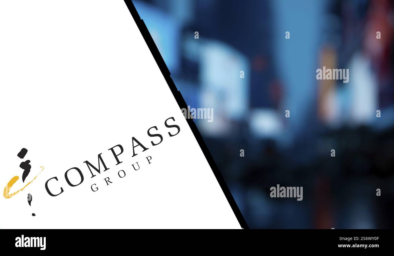 Compass Group logo is displayed on smartphone Stock Photo - Alamy