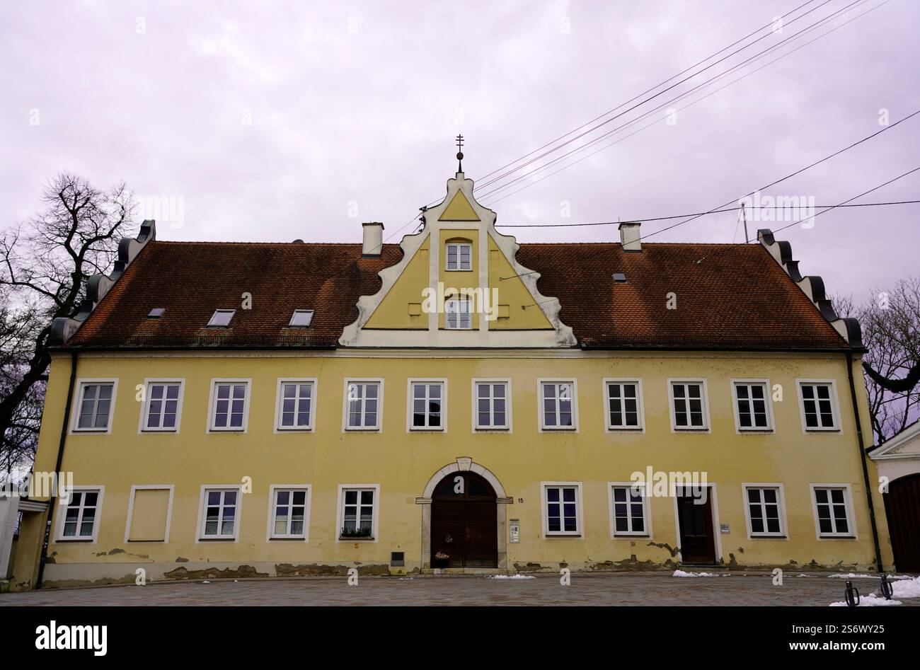 Old building painted yellow in the centre of a medieval town in Bavaria ...