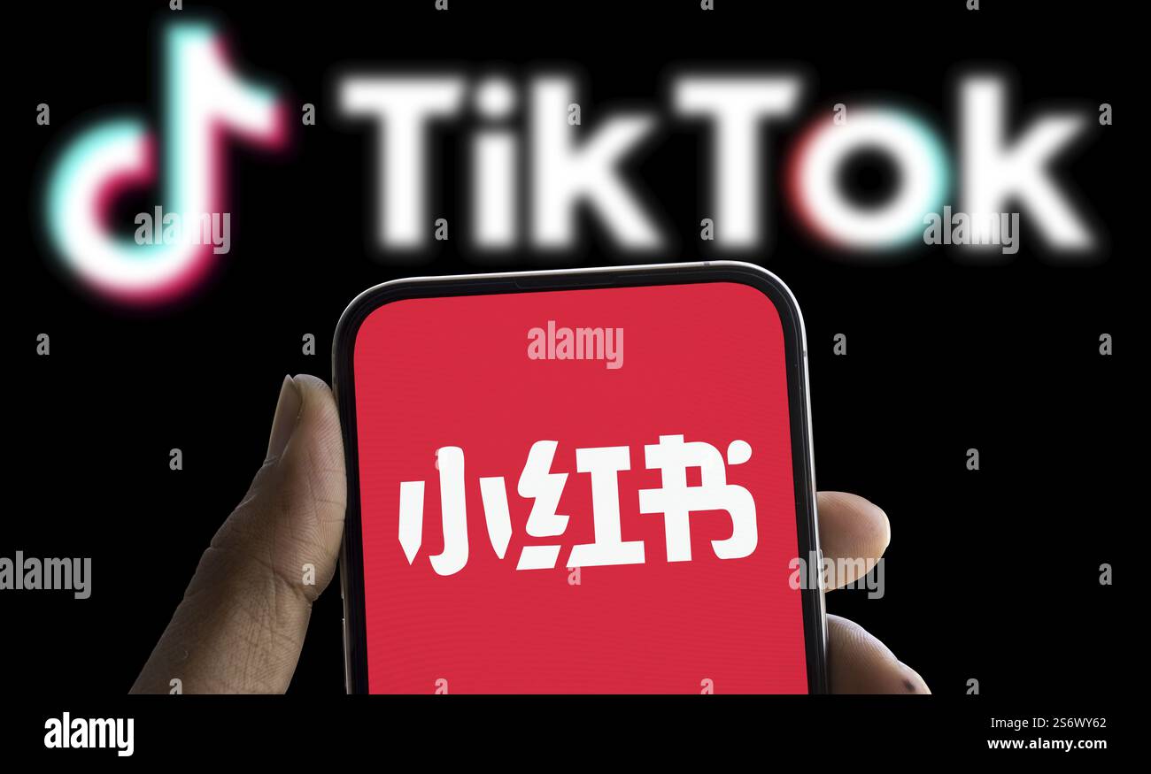 Xiaohongshu (REDnote) logo is displayed on smartphone and tiktok logo ...
