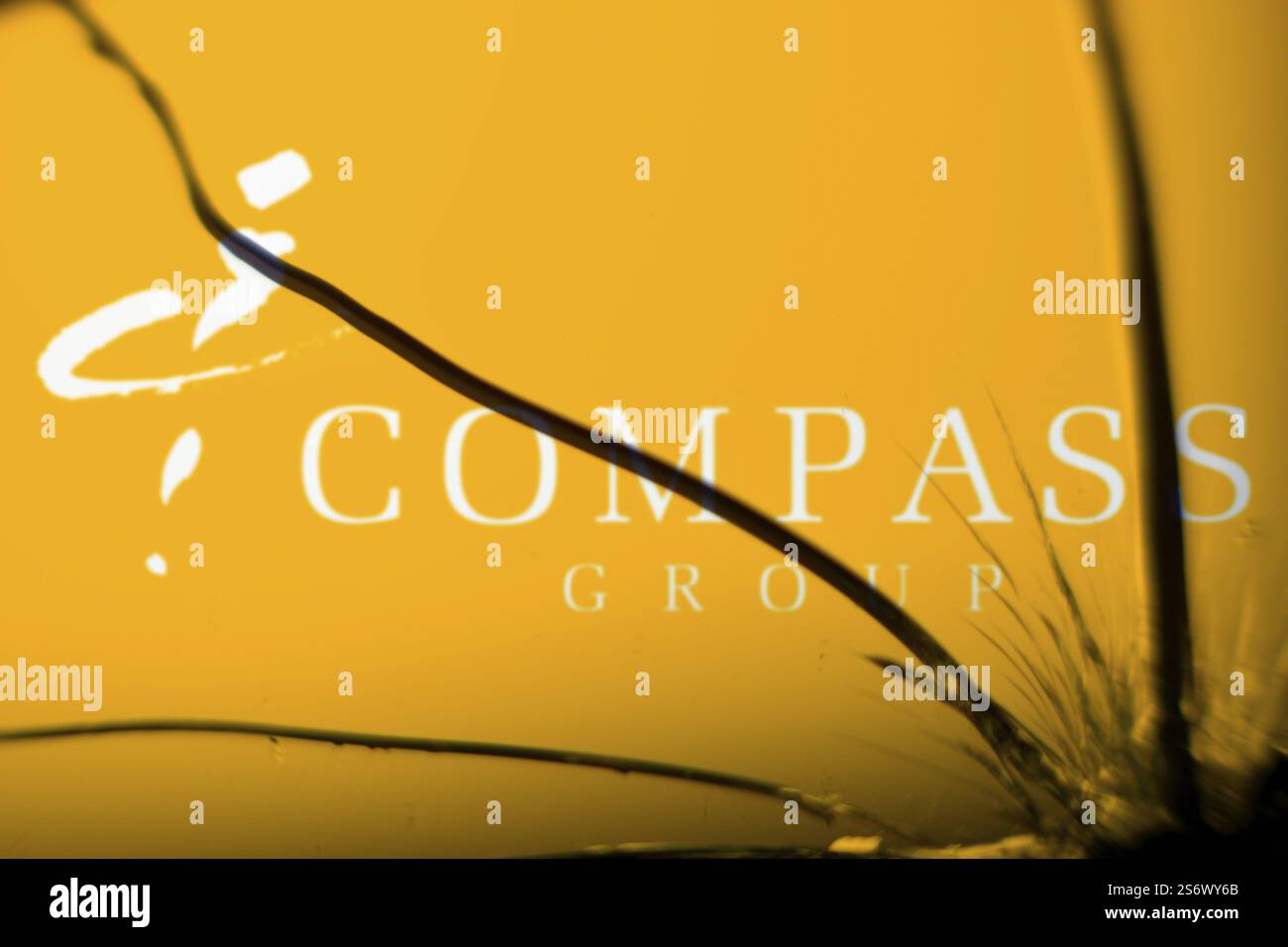 Compass Group logo is visible on the broken glass Stock Photo - Alamy