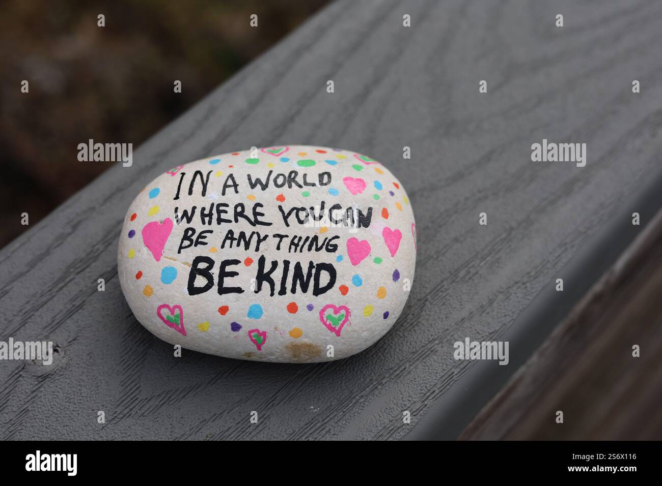 Be kind kindness rock on fence rail Stock Photo - Alamy
