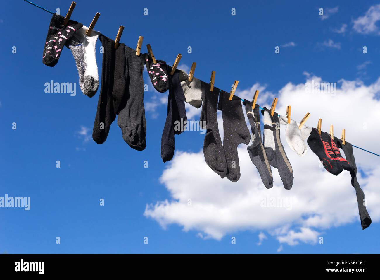 Washing line with sock drying outdoor with sky background Stock Photo ...