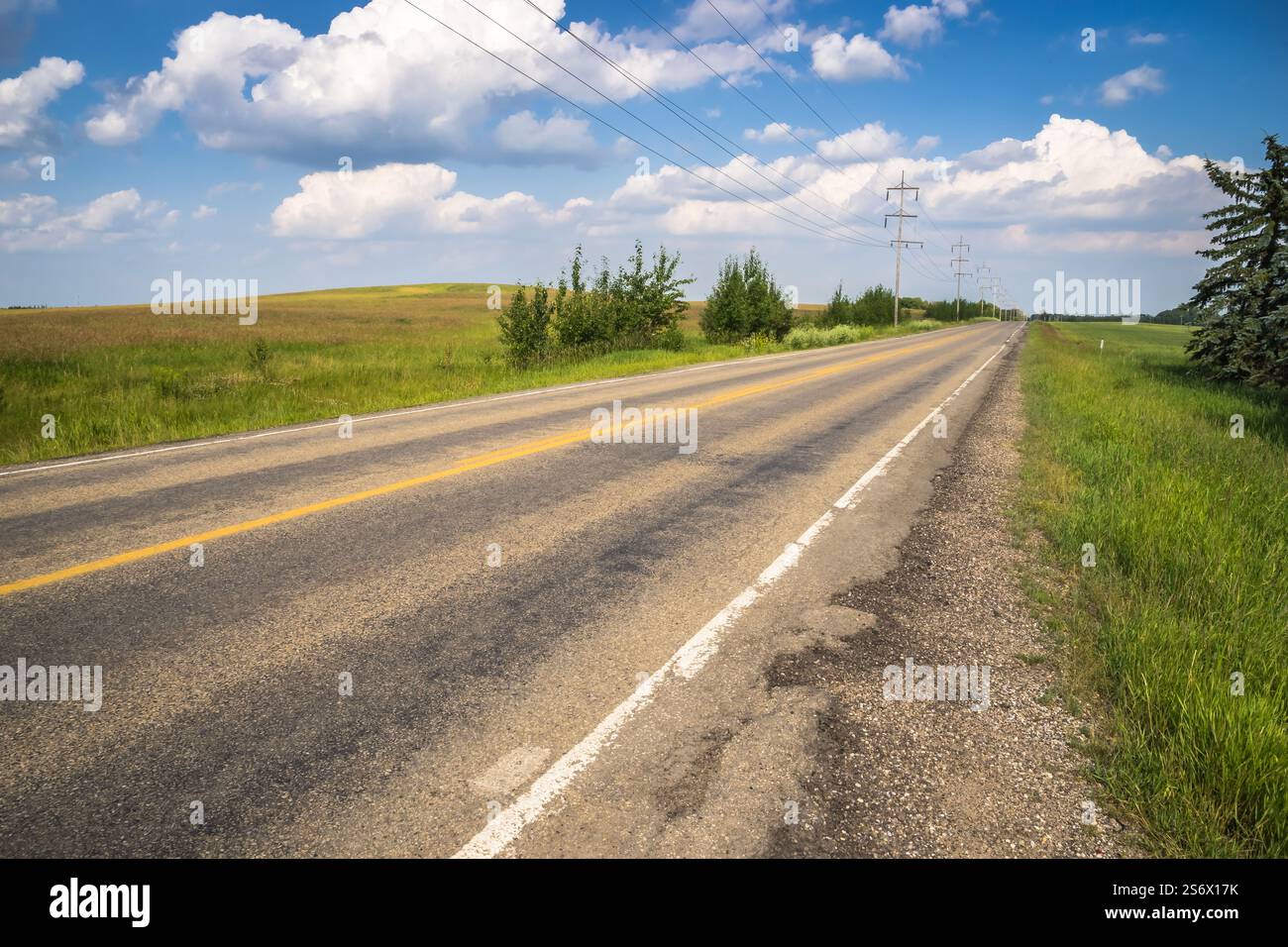 Alberta rural highway crossing farmers field and powerline Stock Photo ...