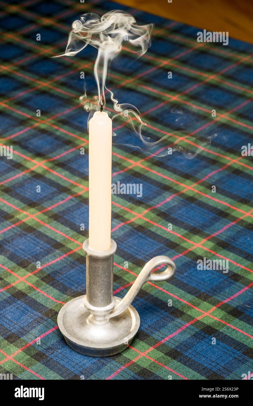 Extinguished candle with smoke Stock Photo - Alamy