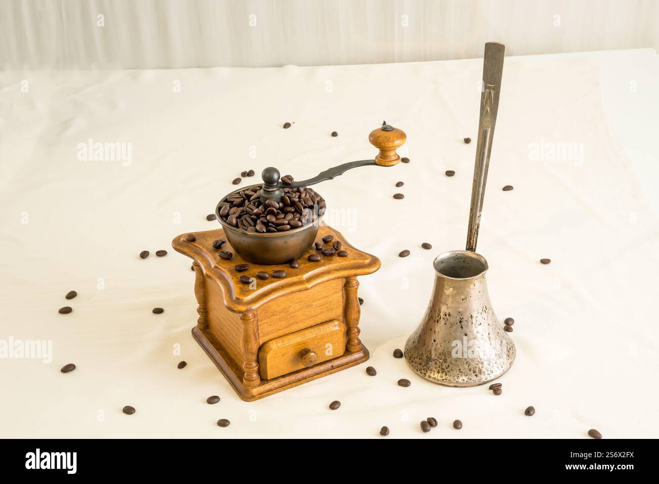 Manual coffee grinder and German silver cezve (ibrik Stock Photo - Alamy
