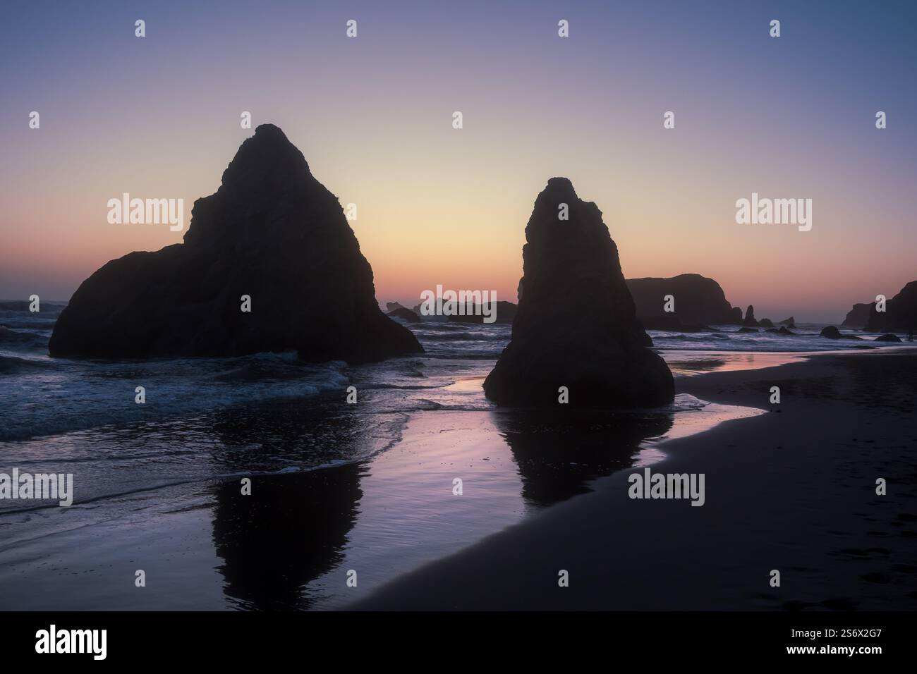 Scenic landscape of sea stacks at Bandon beach against sunset time in ...