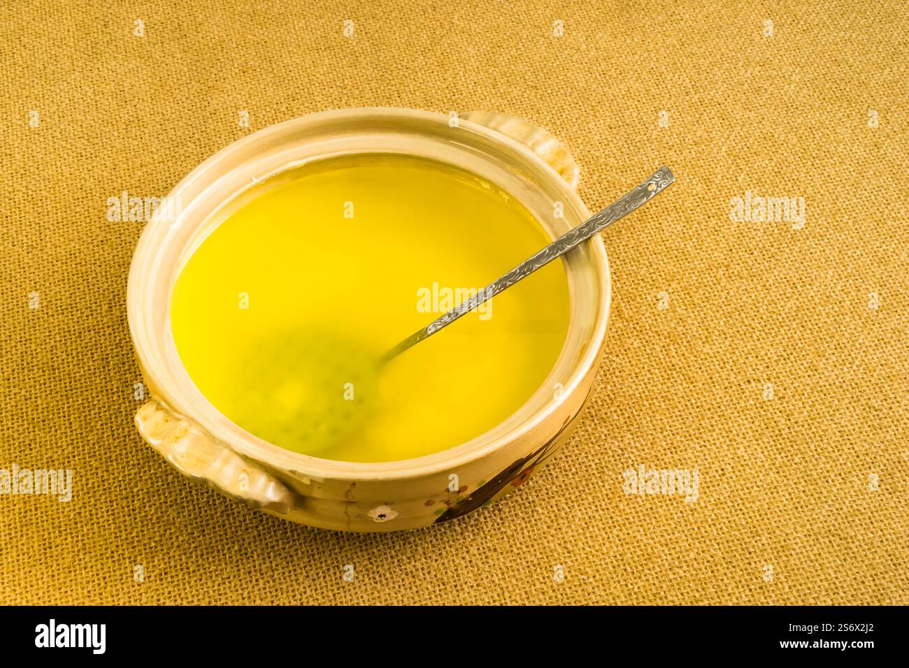 Liquid whey remaining after milk has been curdled and strained Stock ...