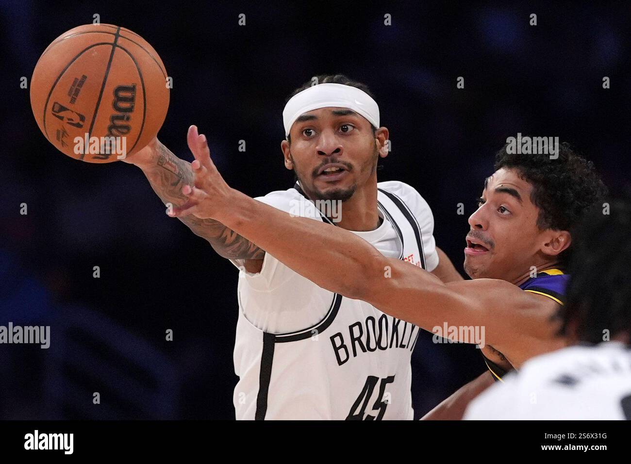 Brooklyn Nets guard Keon Johnson, left, and Los Angeles Lakers guard ...
