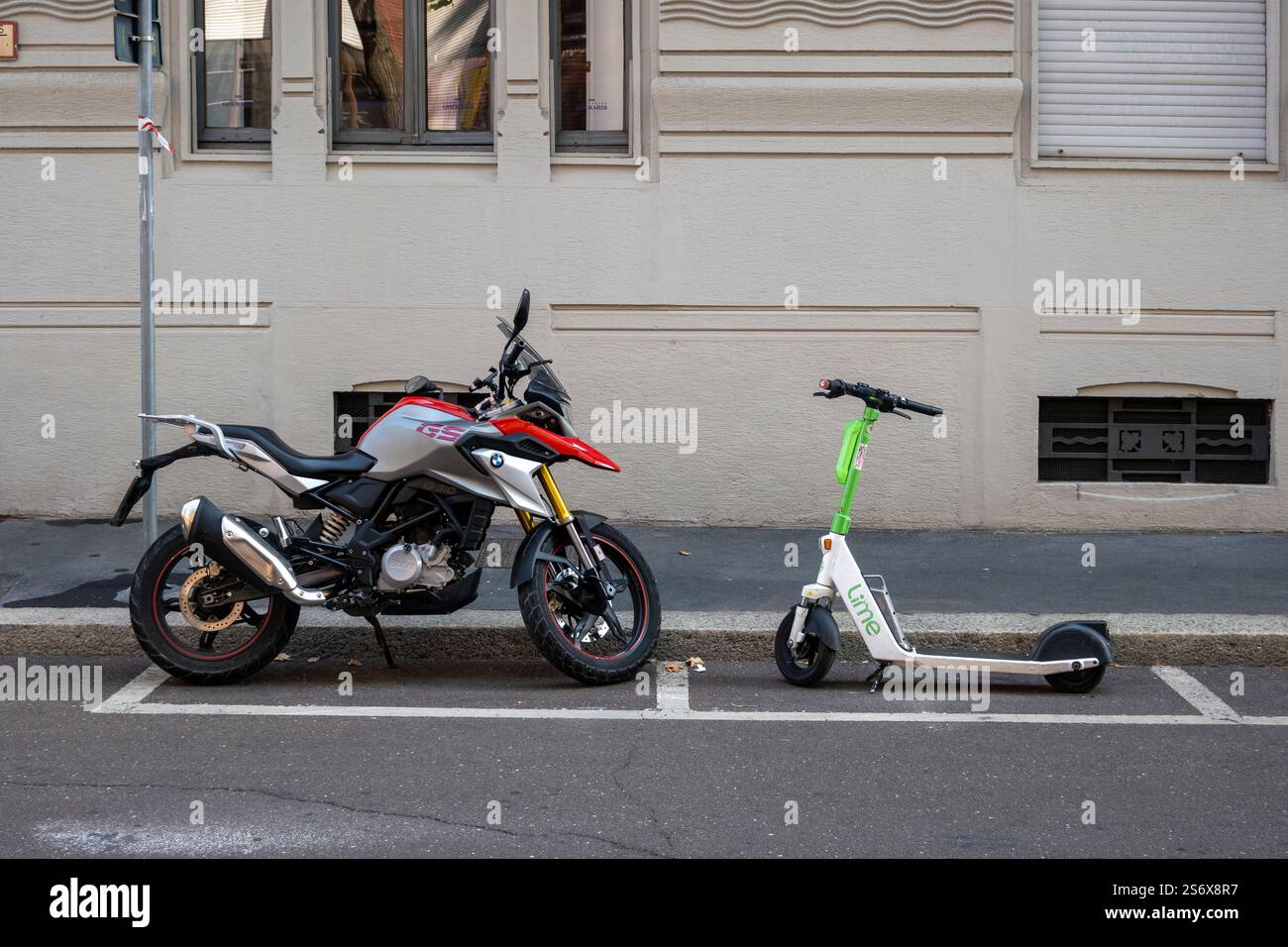 Difference between motorcycle and electric scooter parking Stock Photo ...