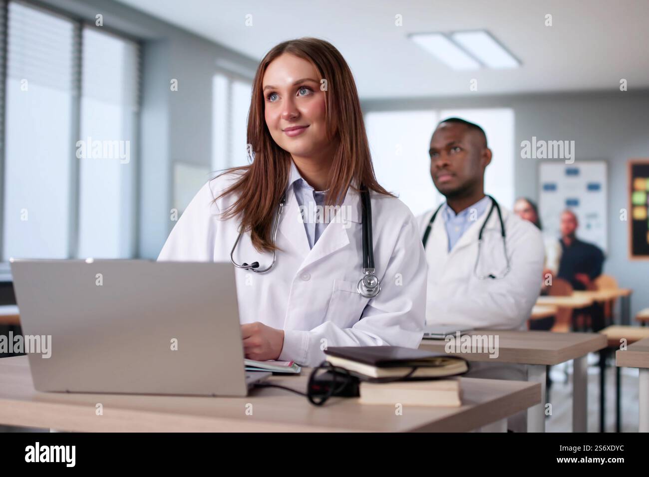 Medical University Students Listening To Professor Doctor In Classroom ...